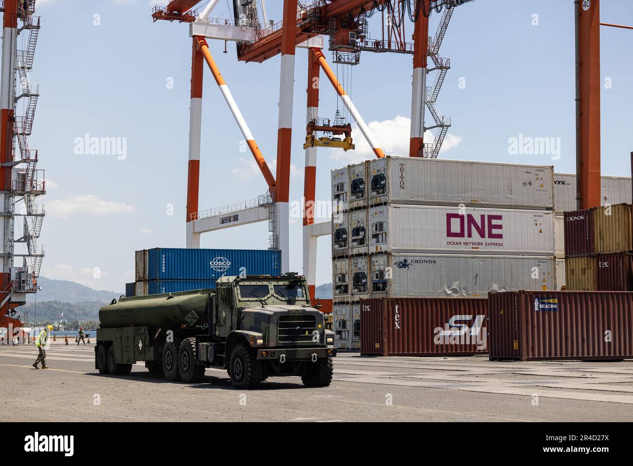 U.S. Marines with 3rd Landing Support Battalion drive an M970 Semi ...