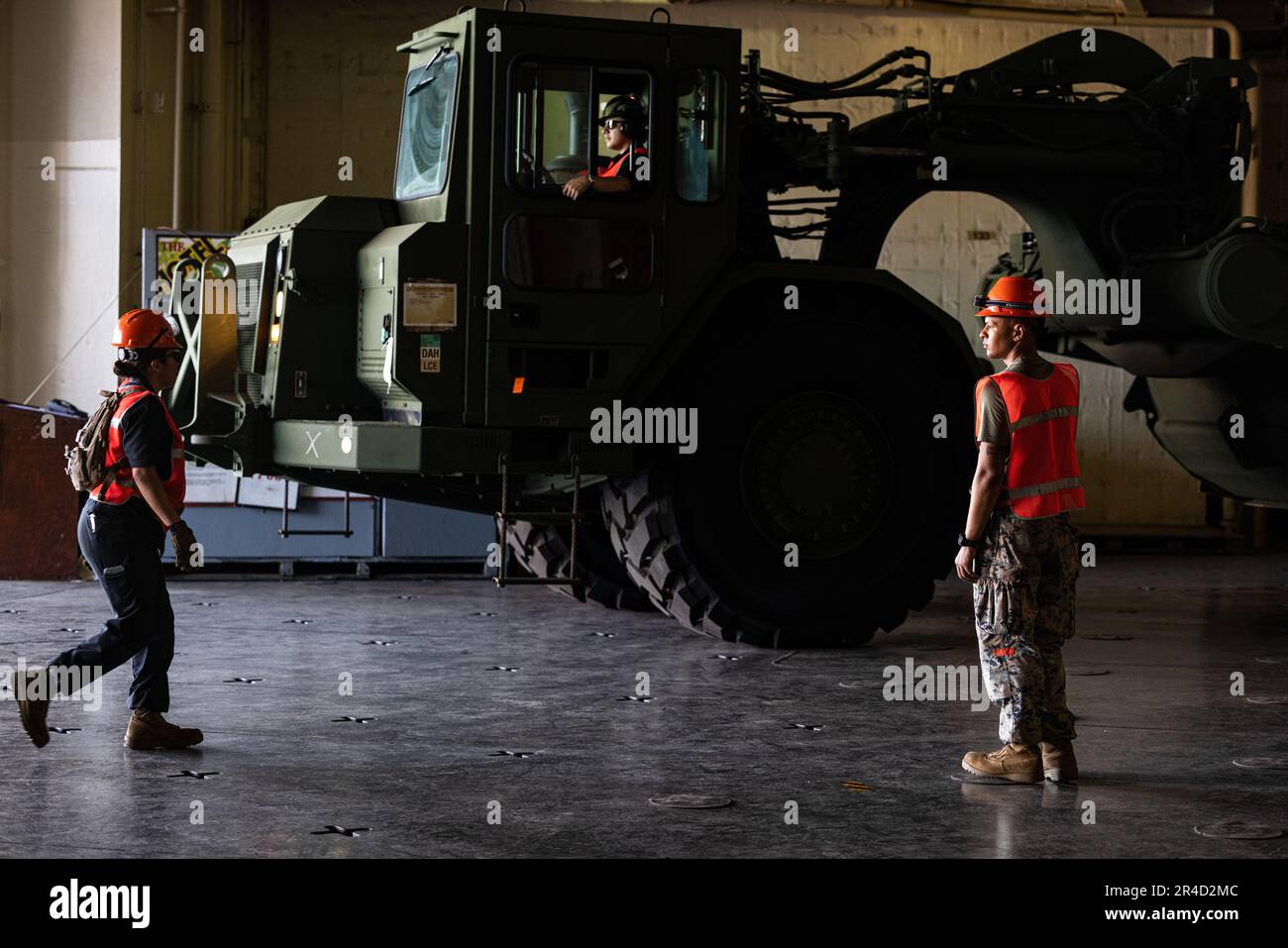 U.S. Marines with 3rd Landing Support Battalion prepare to guide a 621B ...