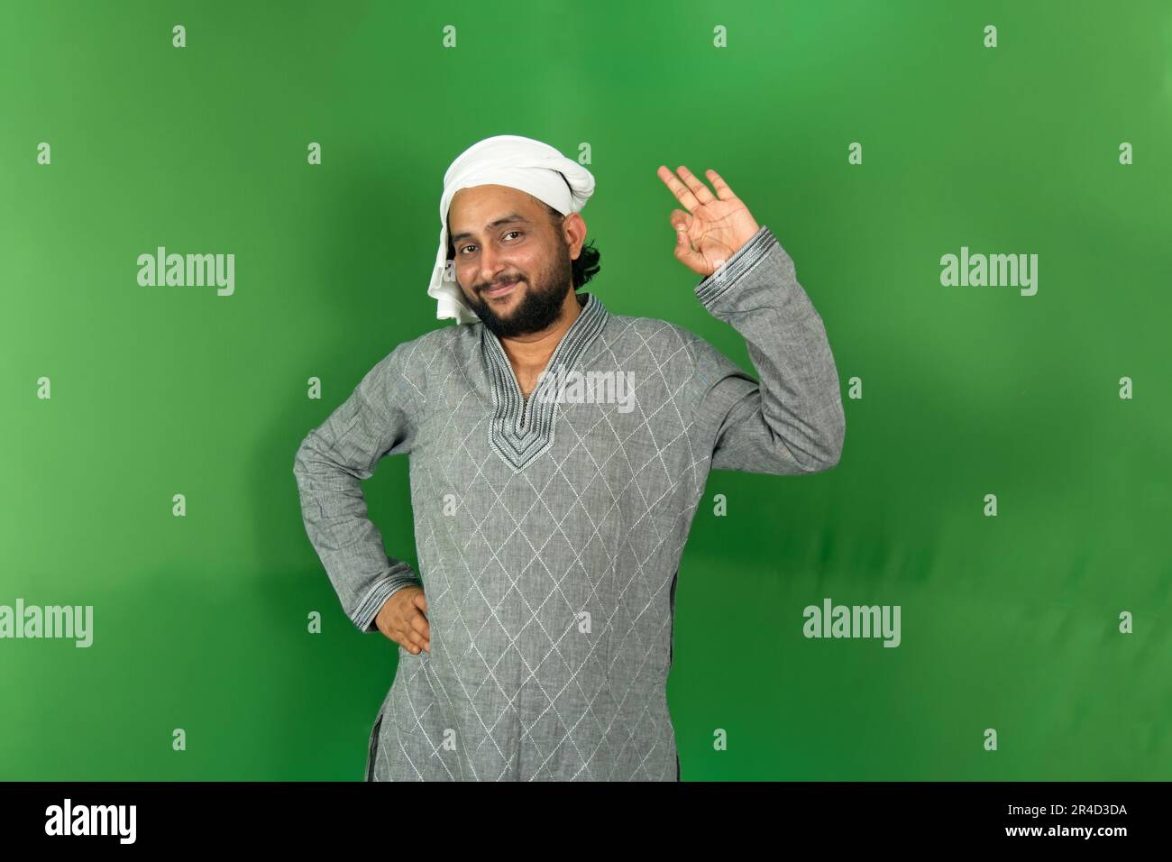 Young Indian farmer okay symbol on left hand with smiling and looking ...