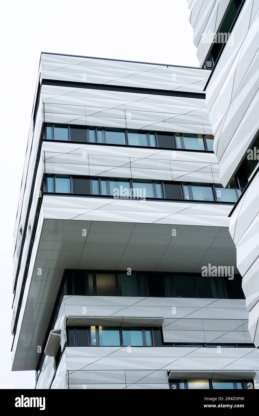 A modern architectural structure featuring a unique black-tinted window ...