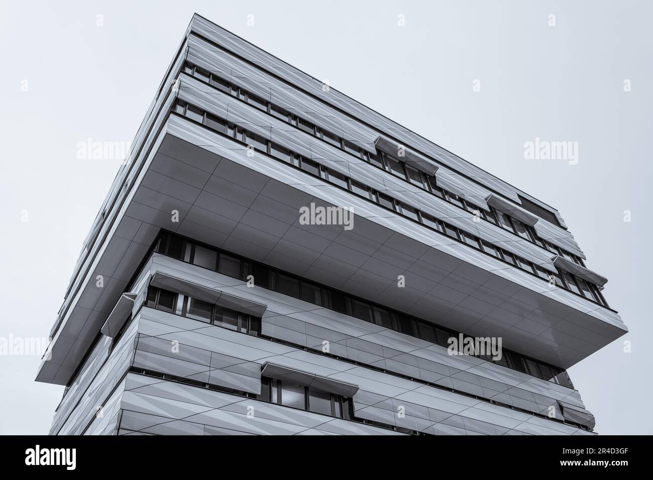 A stunning image of a modern high-rise building against a bright blue ...