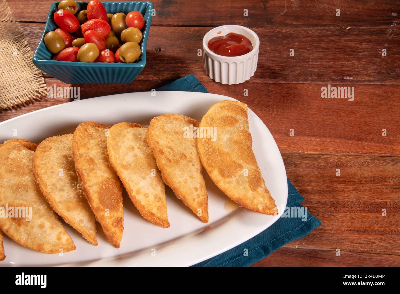 Fried Pastries, Pastel Frito Brasileiro, on wooden table. Pastel de ...