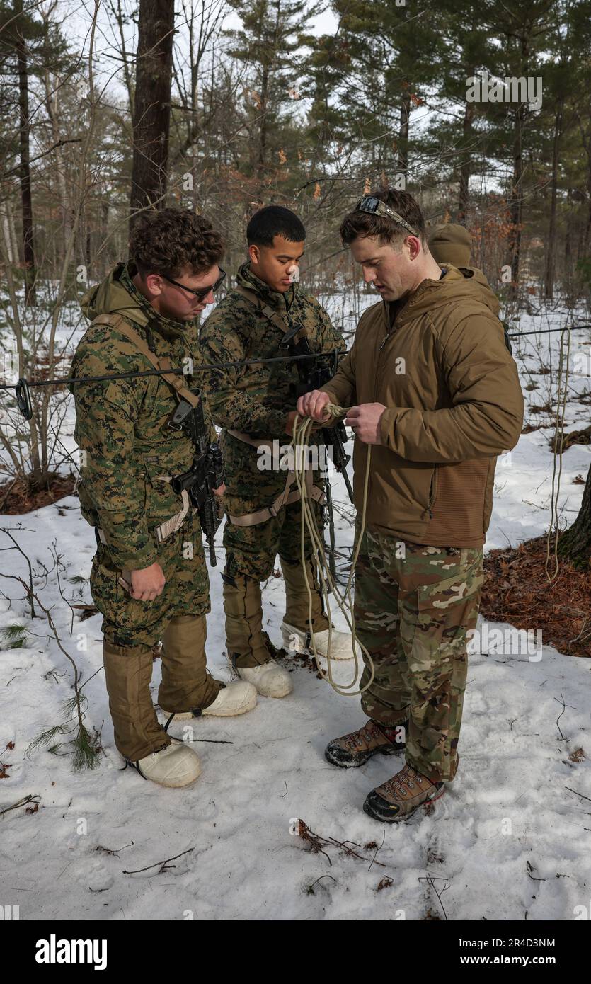 U.S. Army Capt. Ian Brambs (right), commander of Light Fighter School ...