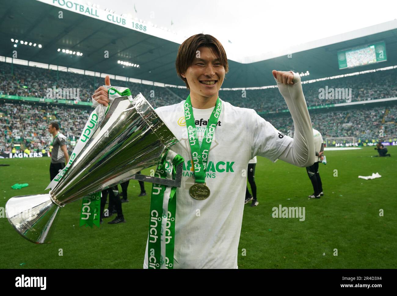 Celtic's Kyogo Furuhashi celebrates with the league trophy after the ...