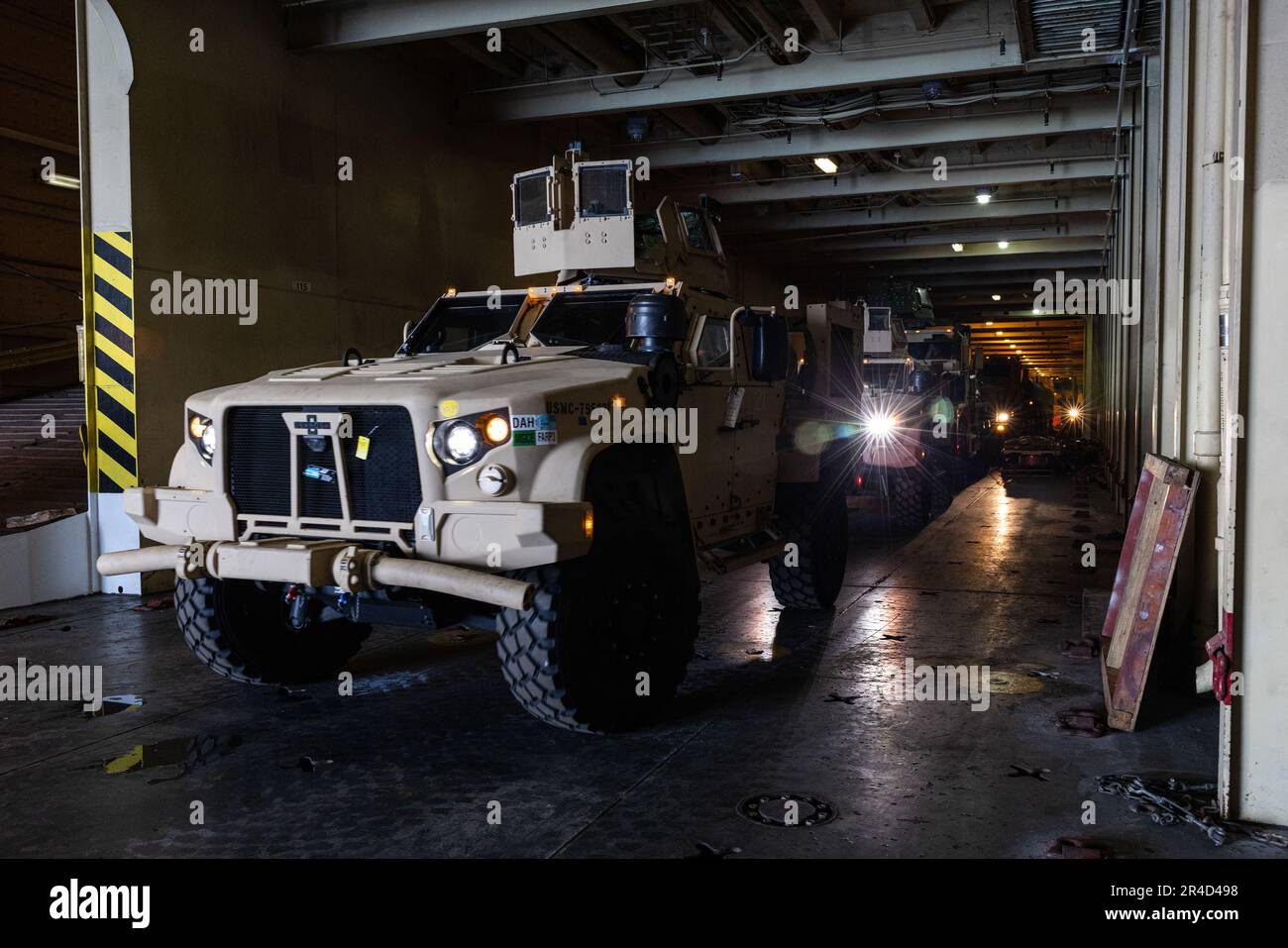 U.S. Marines with 3rd Landing Support Battalion operate vehicles aboard ...