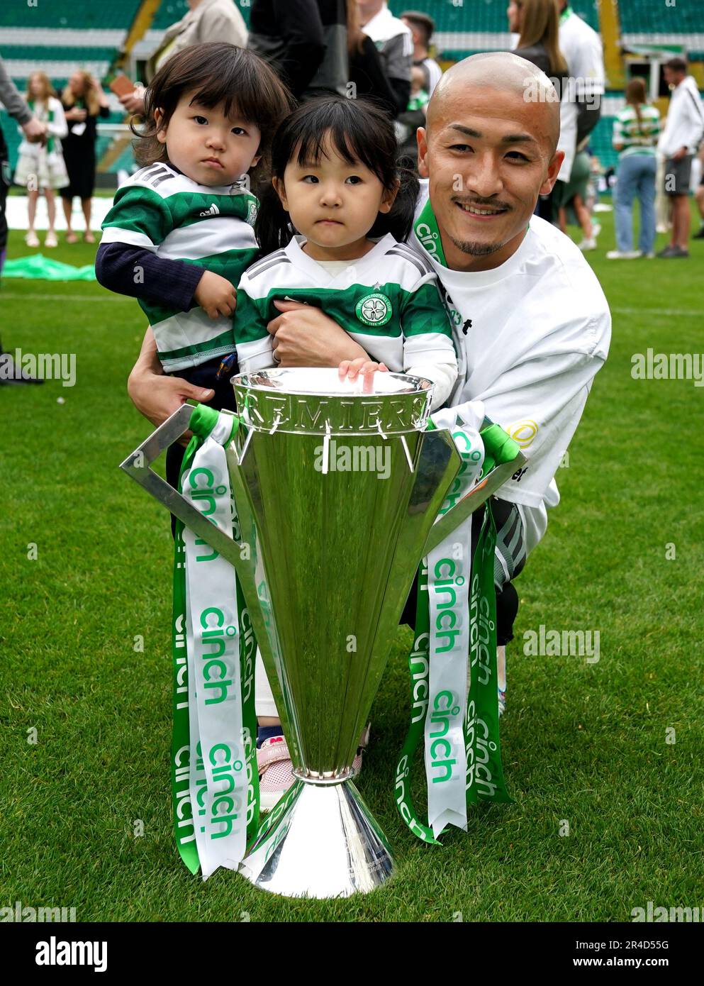 Celtic's Daizen Maeda and family pose with the trophy after the cinch ...