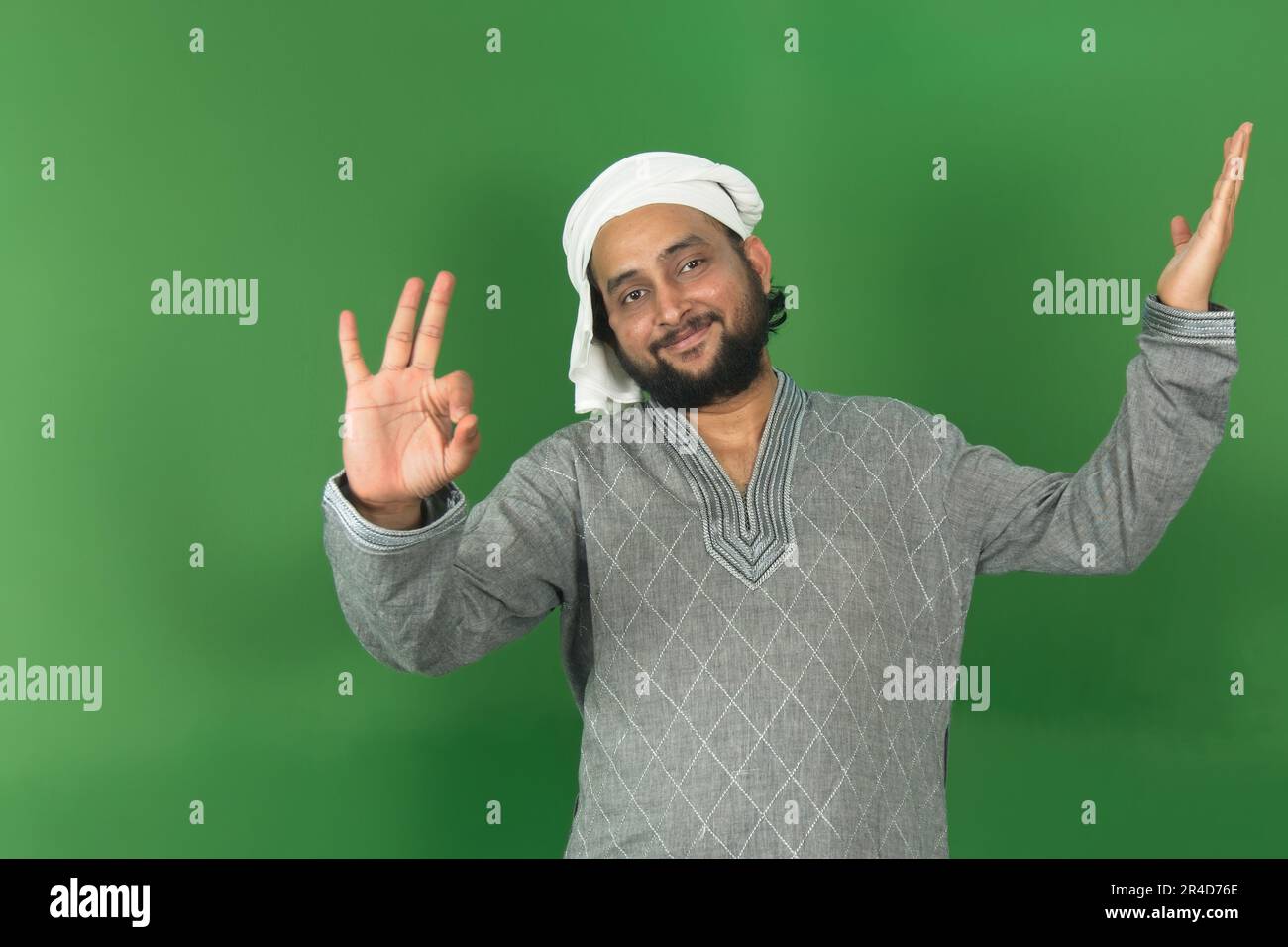 okay symbol in right hand of Young Indian farmer with smiling and ...