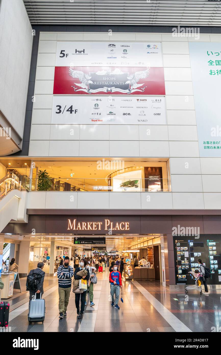Interior of Haneda airport terminal one with the entrance to the Market ...