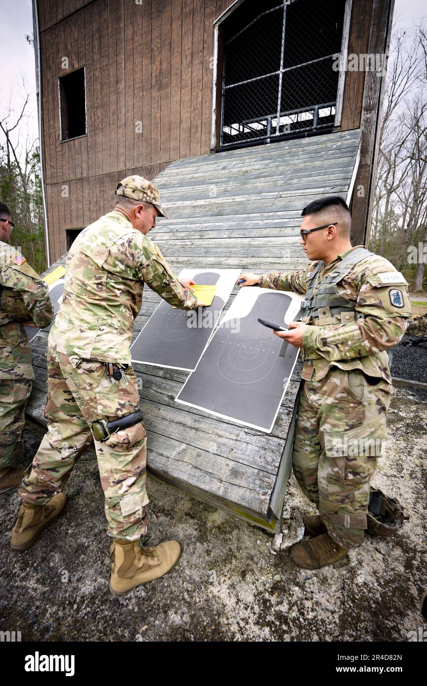 A cadre member scores a Soldiers target after the Soldier completed the ...