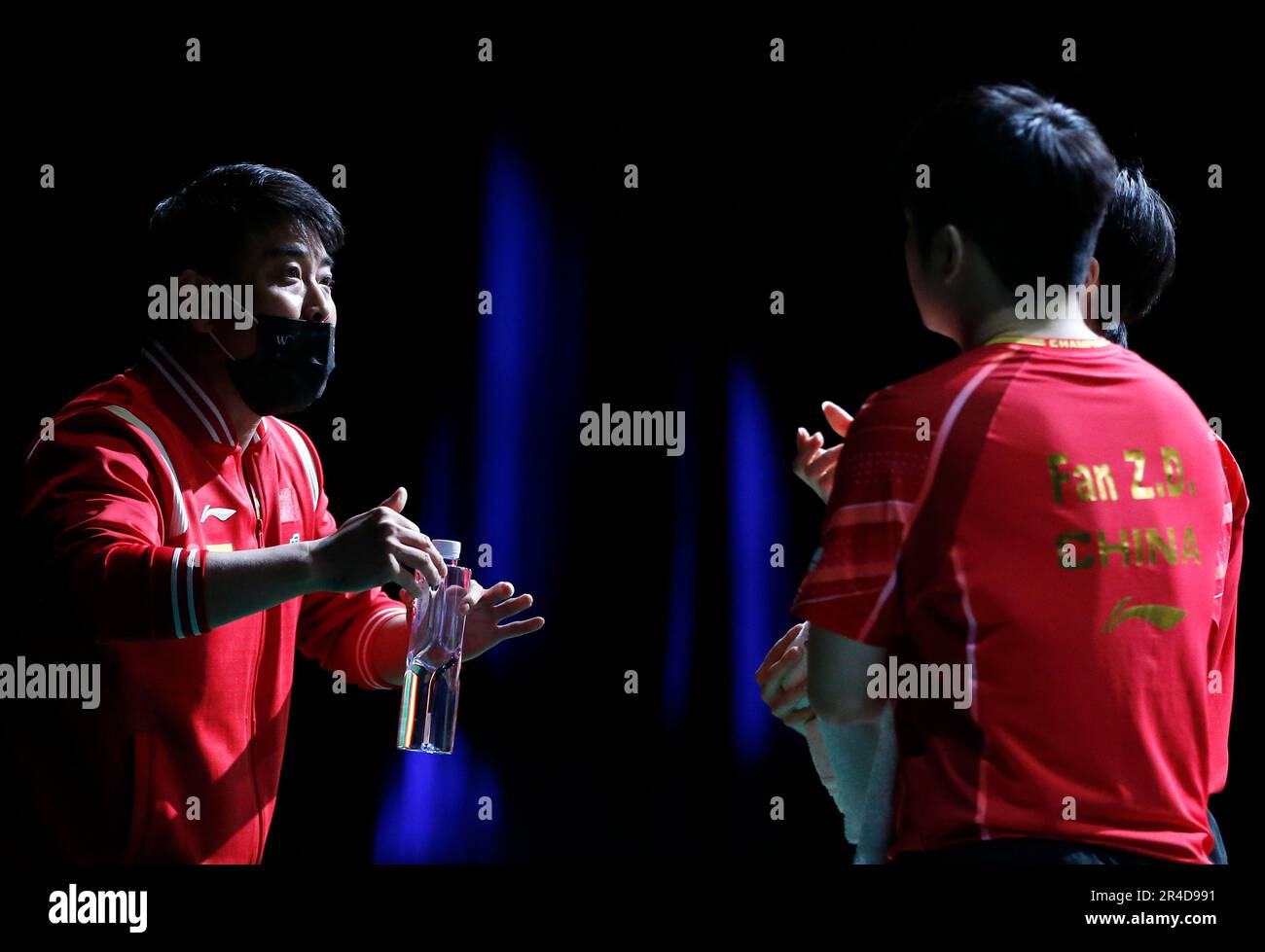 Durban, South Africa. 27th May, 2023. China's coach Wang Hao (L) talks to Fan Zhendong/Wang ...
