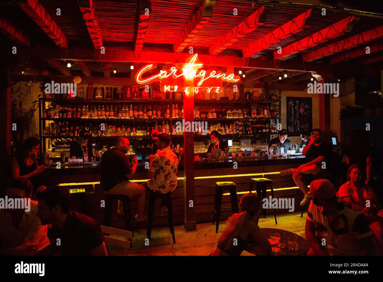 Red neon lights light up a bar in Cartagena Colombia Stock Photo - Alamy