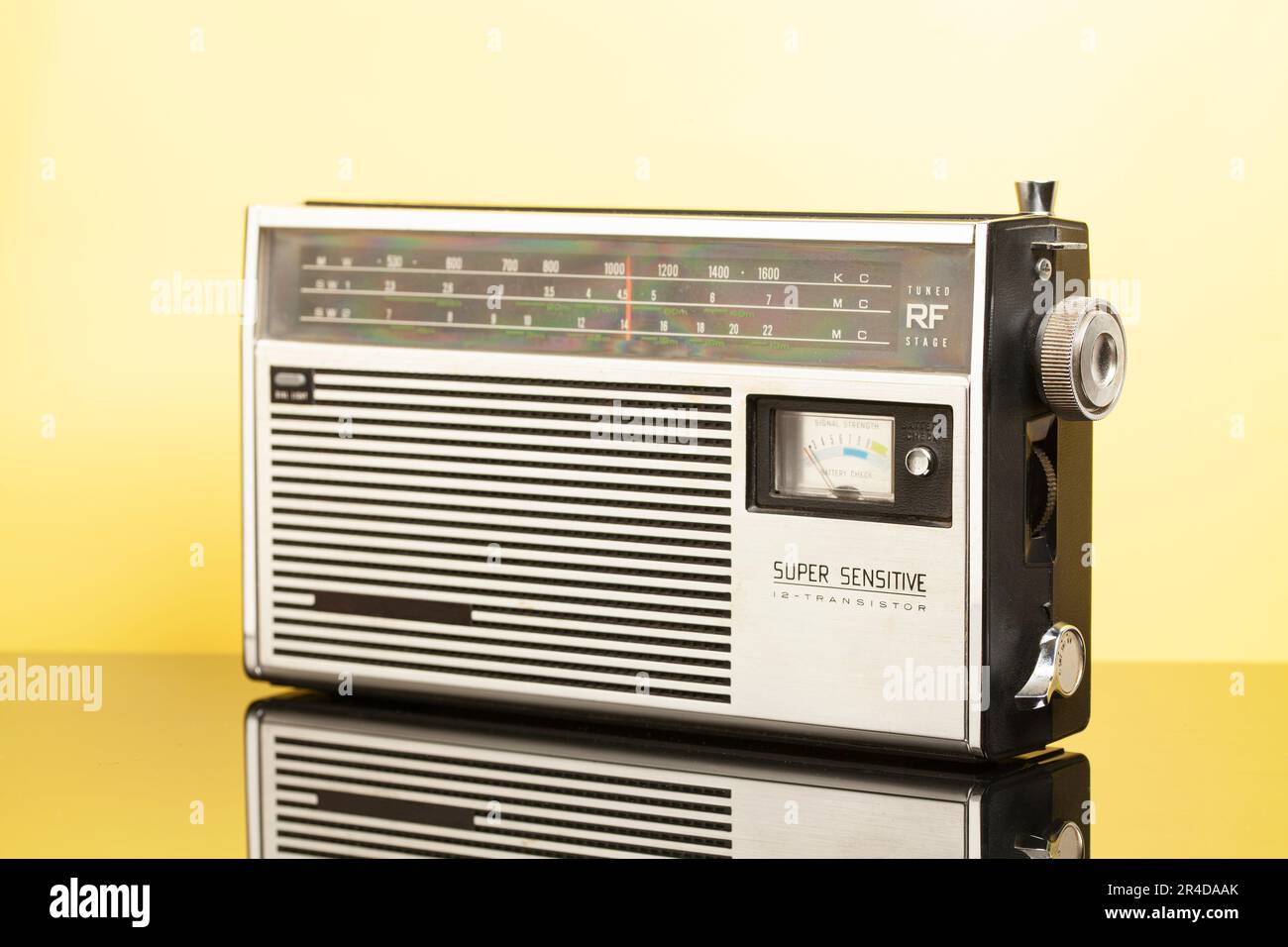 Old transistor radio on a yellow background Stock Photo - Alamy