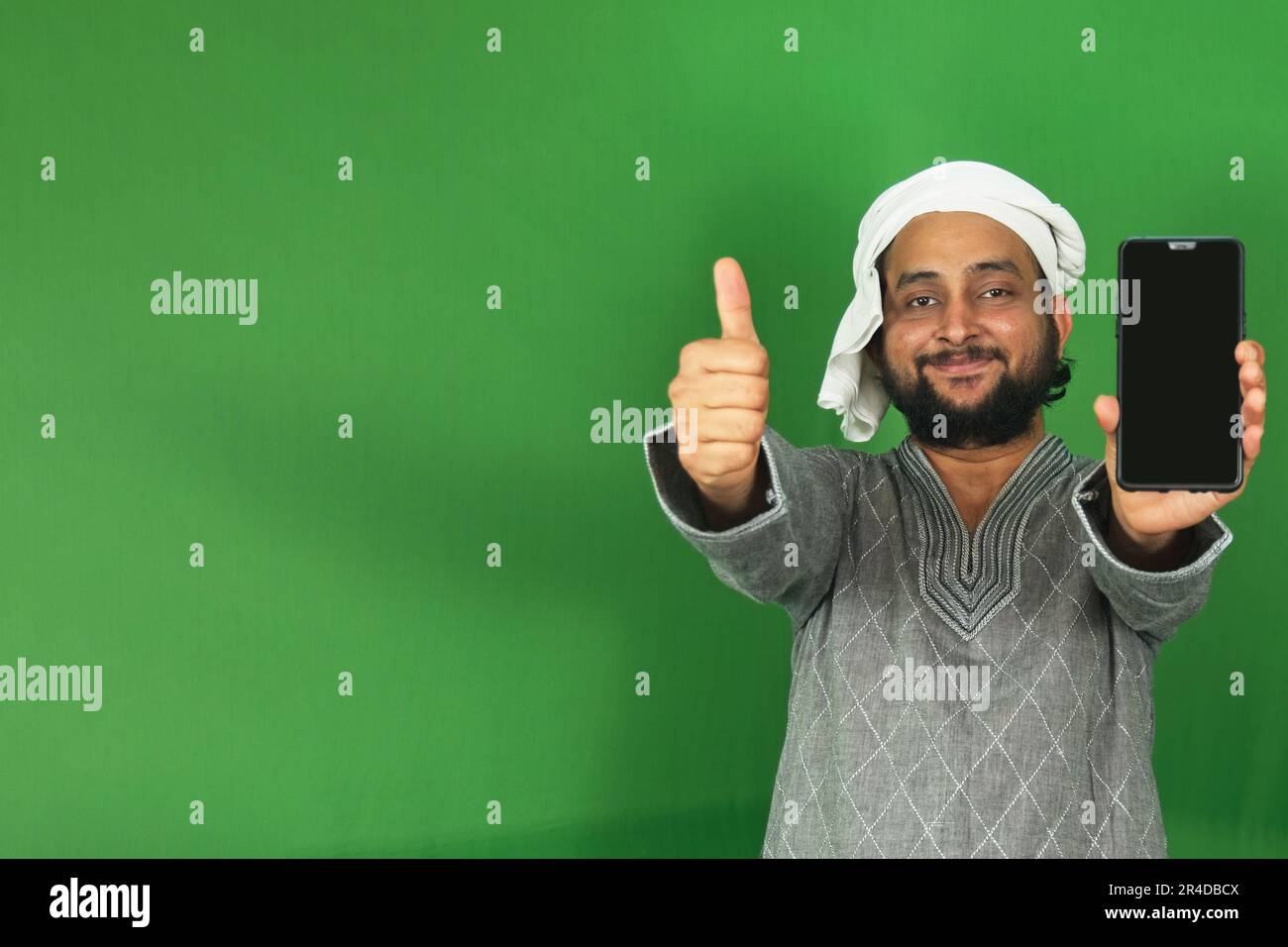 Young Indian Farmer Showing His Mobile And Right Hands Thumbs Up In ...