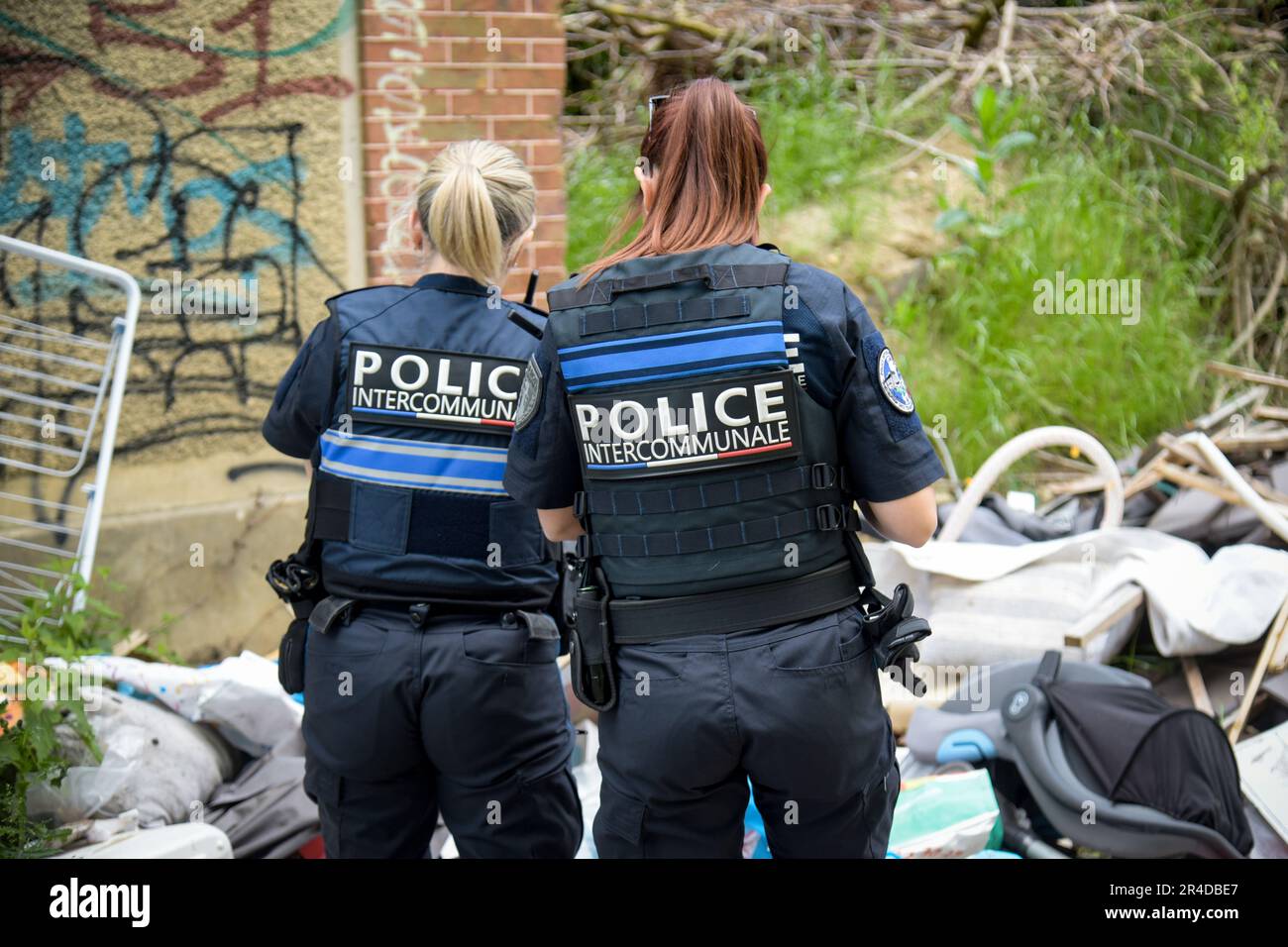 view of police patrol fighting wild depots in rural area in France ...