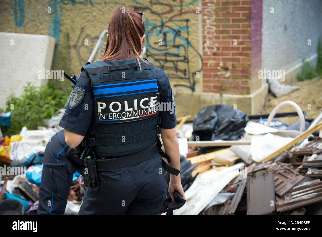 view of police patrol fighting wild depots in rural area in France ...