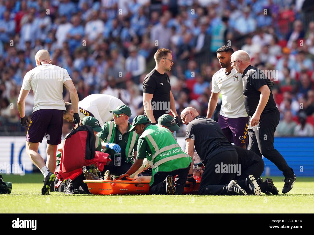 Luton Town's Tom Lockyer receives treatment before leaving the pitch on ...