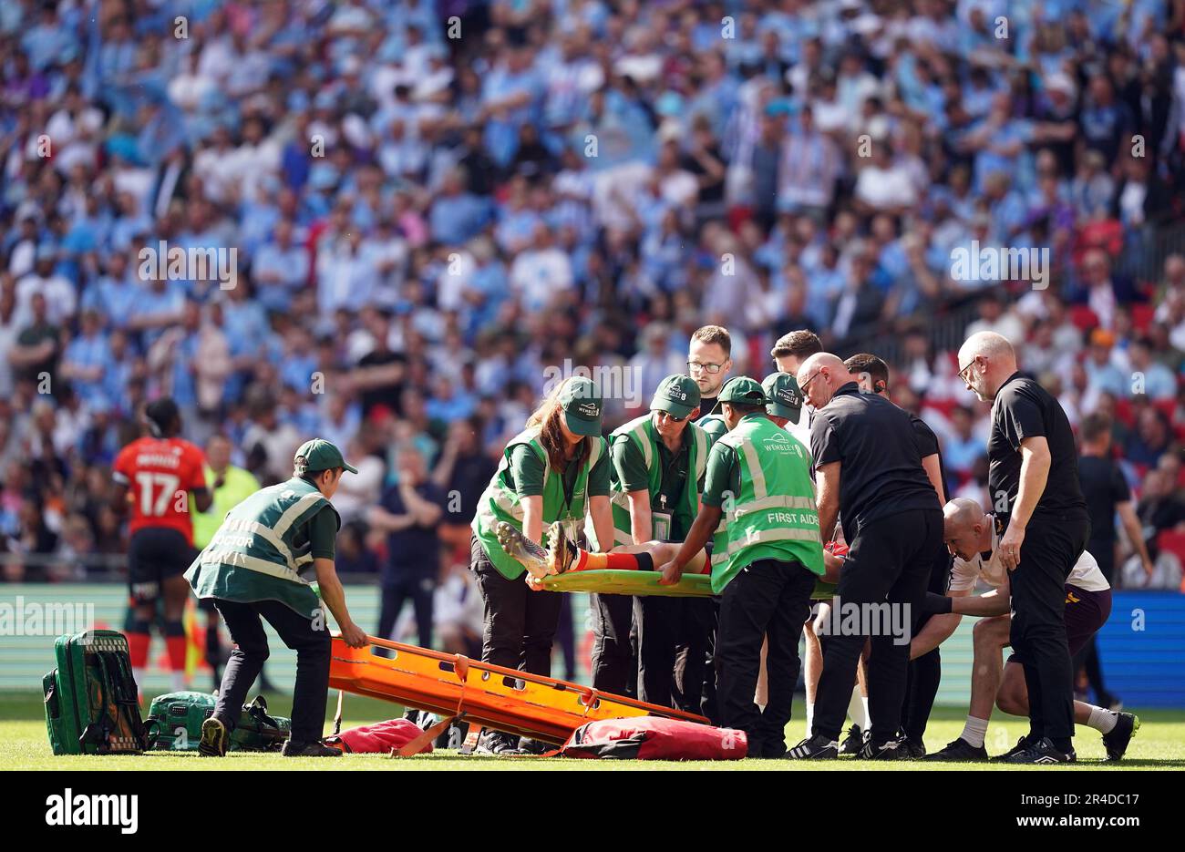 Luton Town's Tom Lockyer receives treatment before leaving the pitch on ...