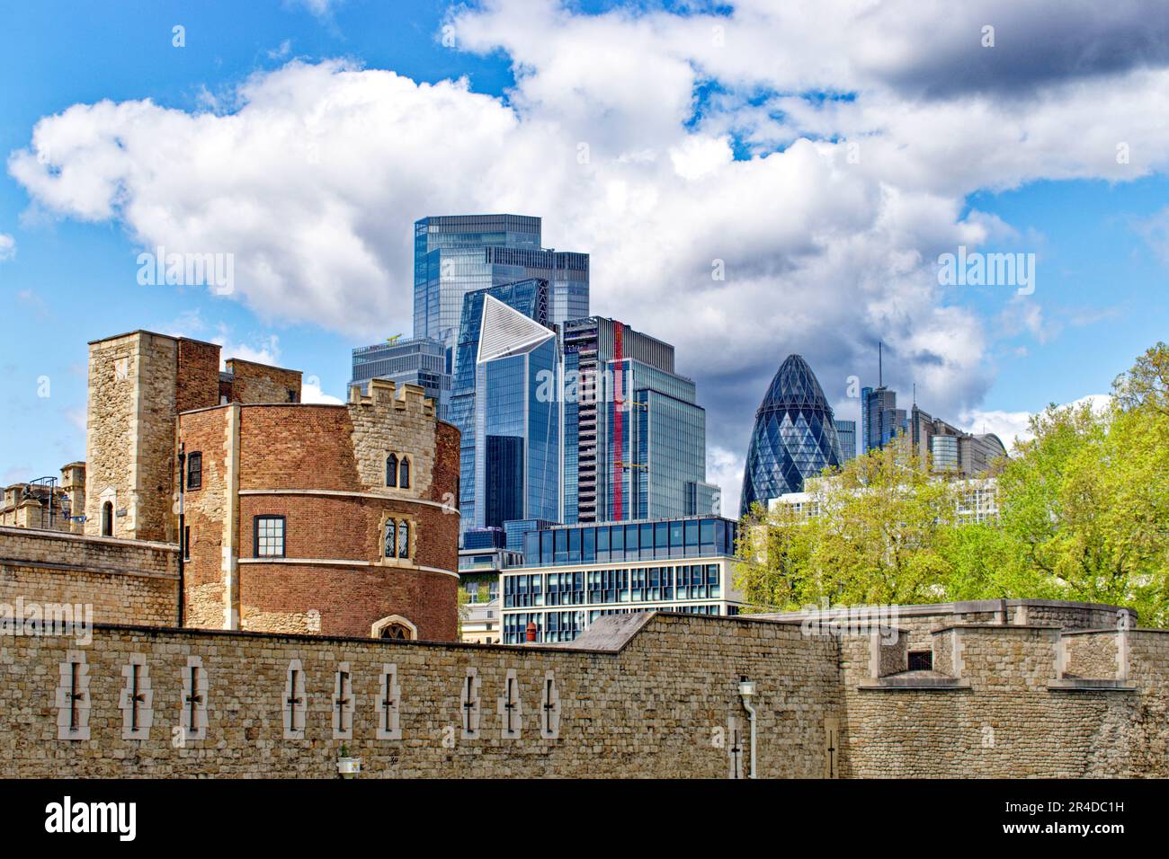 London a blue sky over the walls of the Tower of London alonside the ...