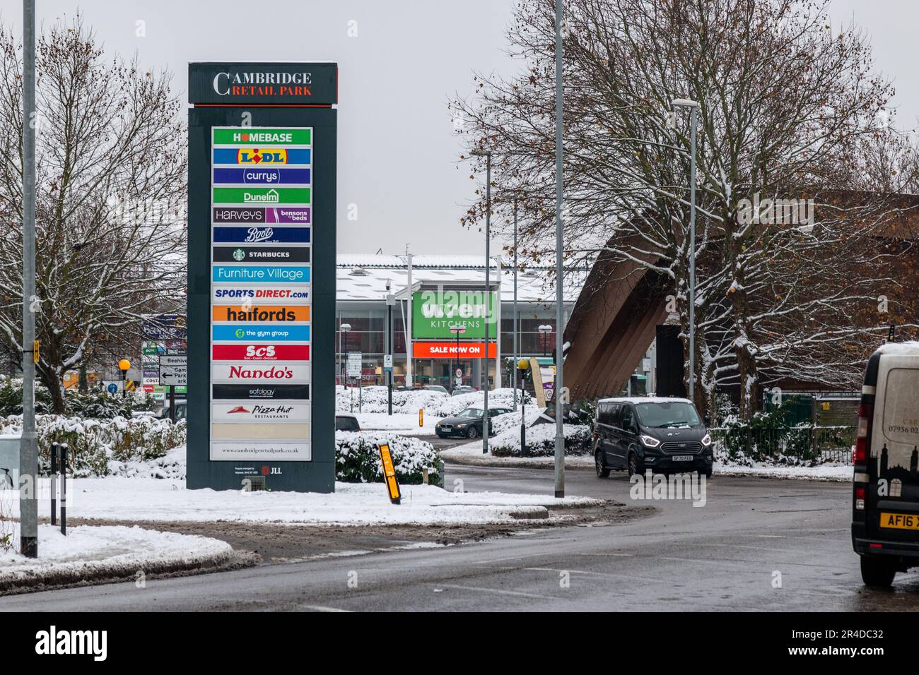 A sign listing all the businesses and shops in the Cambridge Retail ...