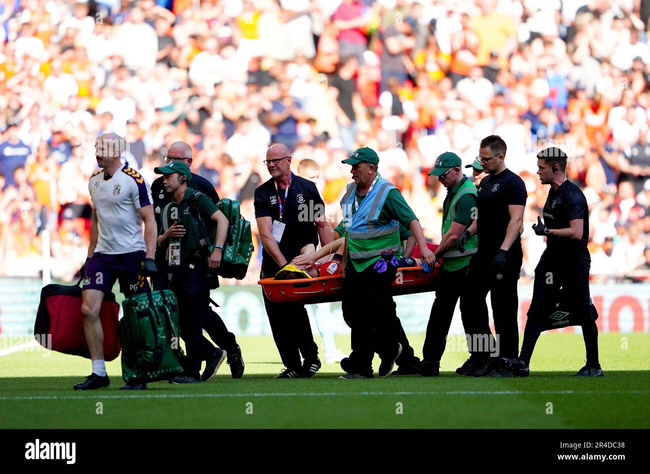 Luton Town's Tom Lockyer leaves the pitch on a stretcher after becoming ...