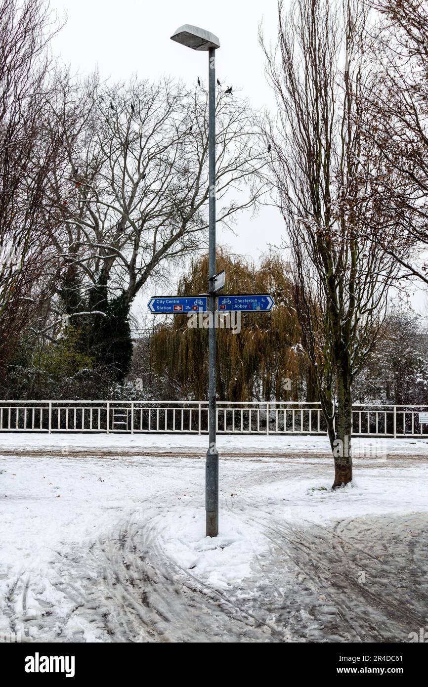 On Riverside, Cambridge, UK a lampost has direction signs for the ...