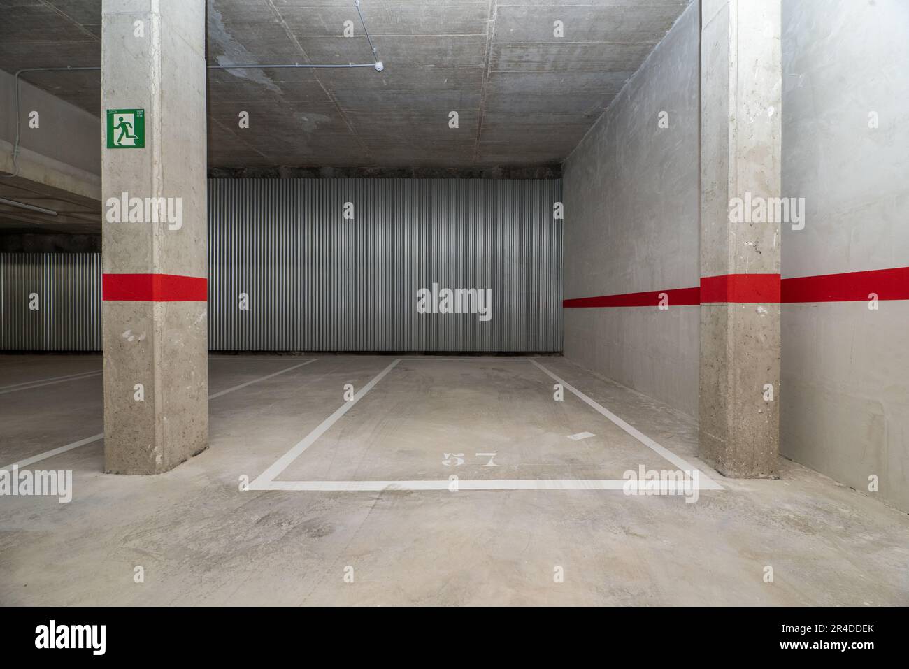 Parking spaces of a residential building with concrete walls and the ...