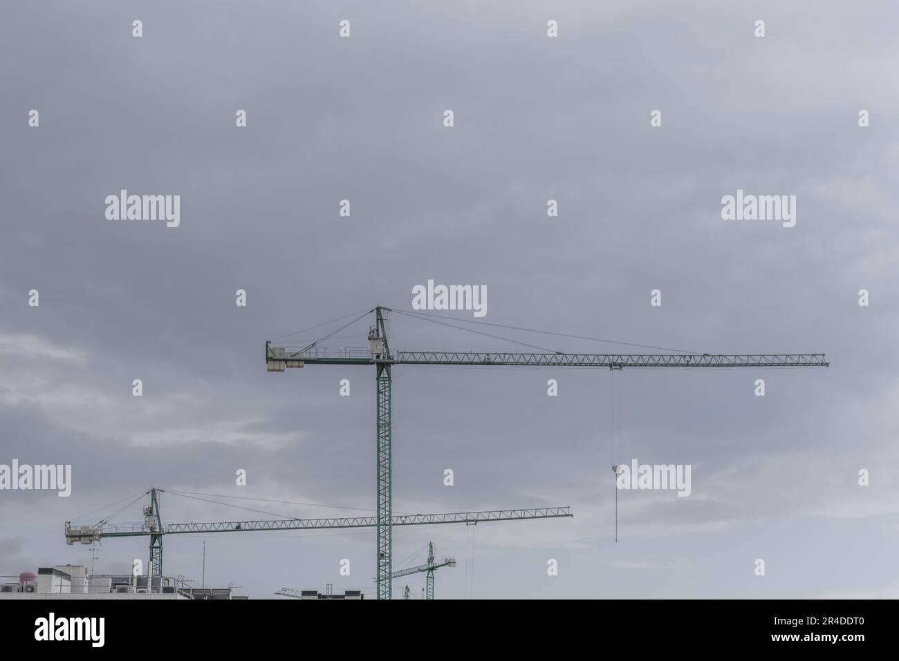 Green cranes with concrete counterweights for the construction of ...