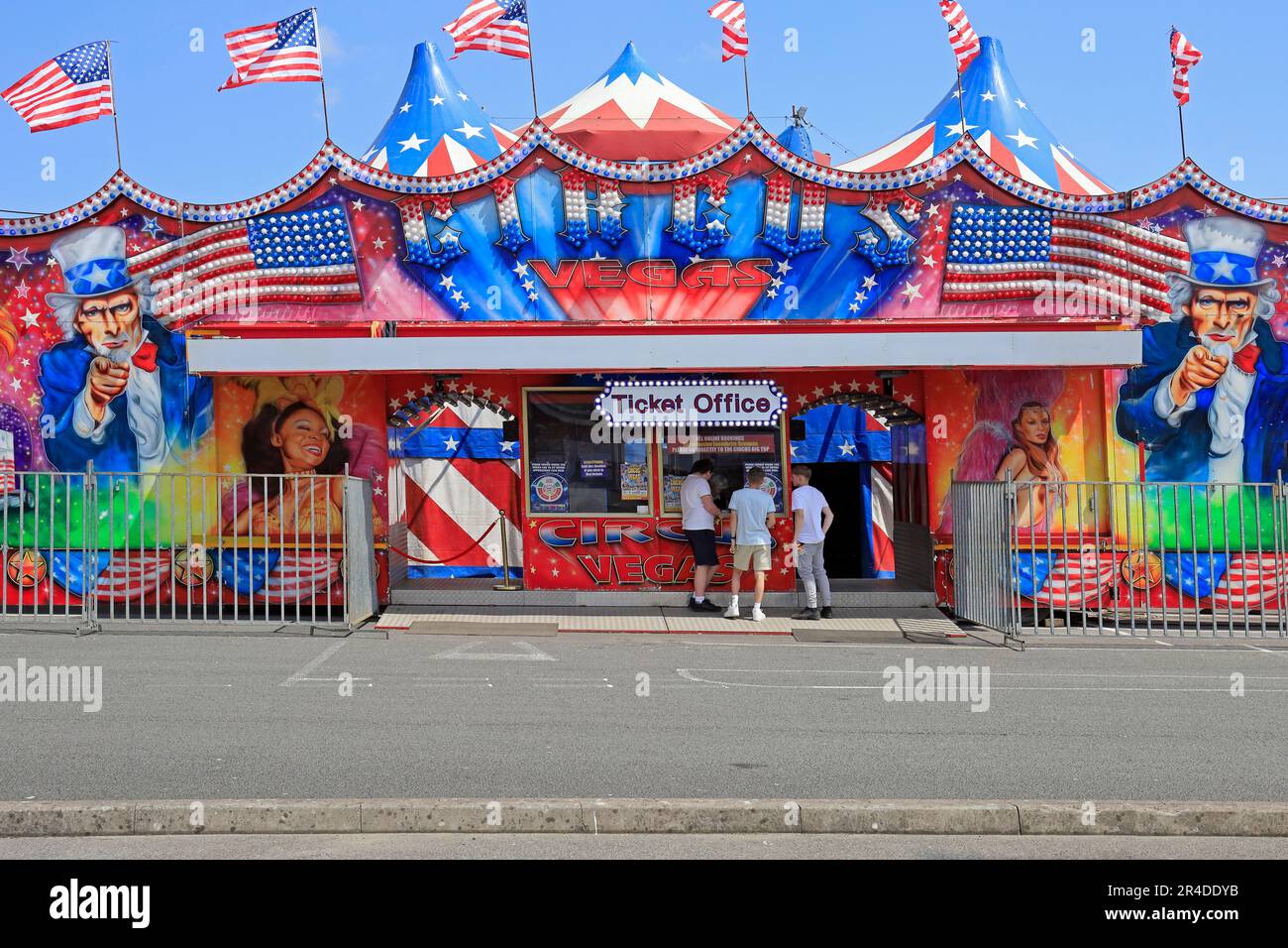 Young men buying tickets at the ticket office, Circus Vegas at Cardiff ...