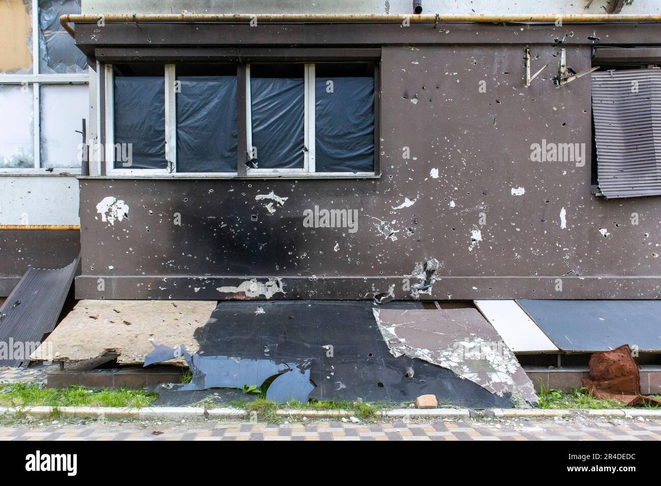 Residential buildings, windows and balconies were damaged by the blast ...