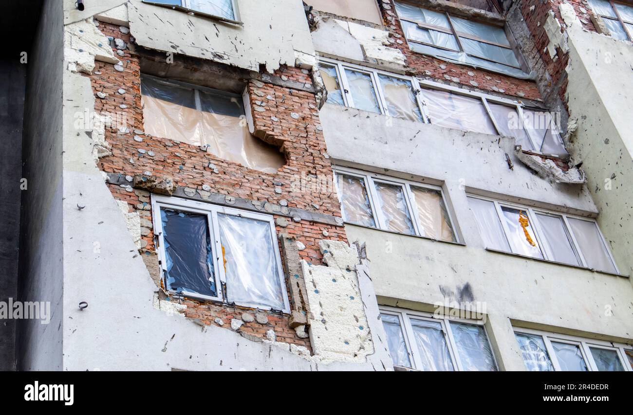 Residential buildings, windows and balconies were damaged by the blast ...