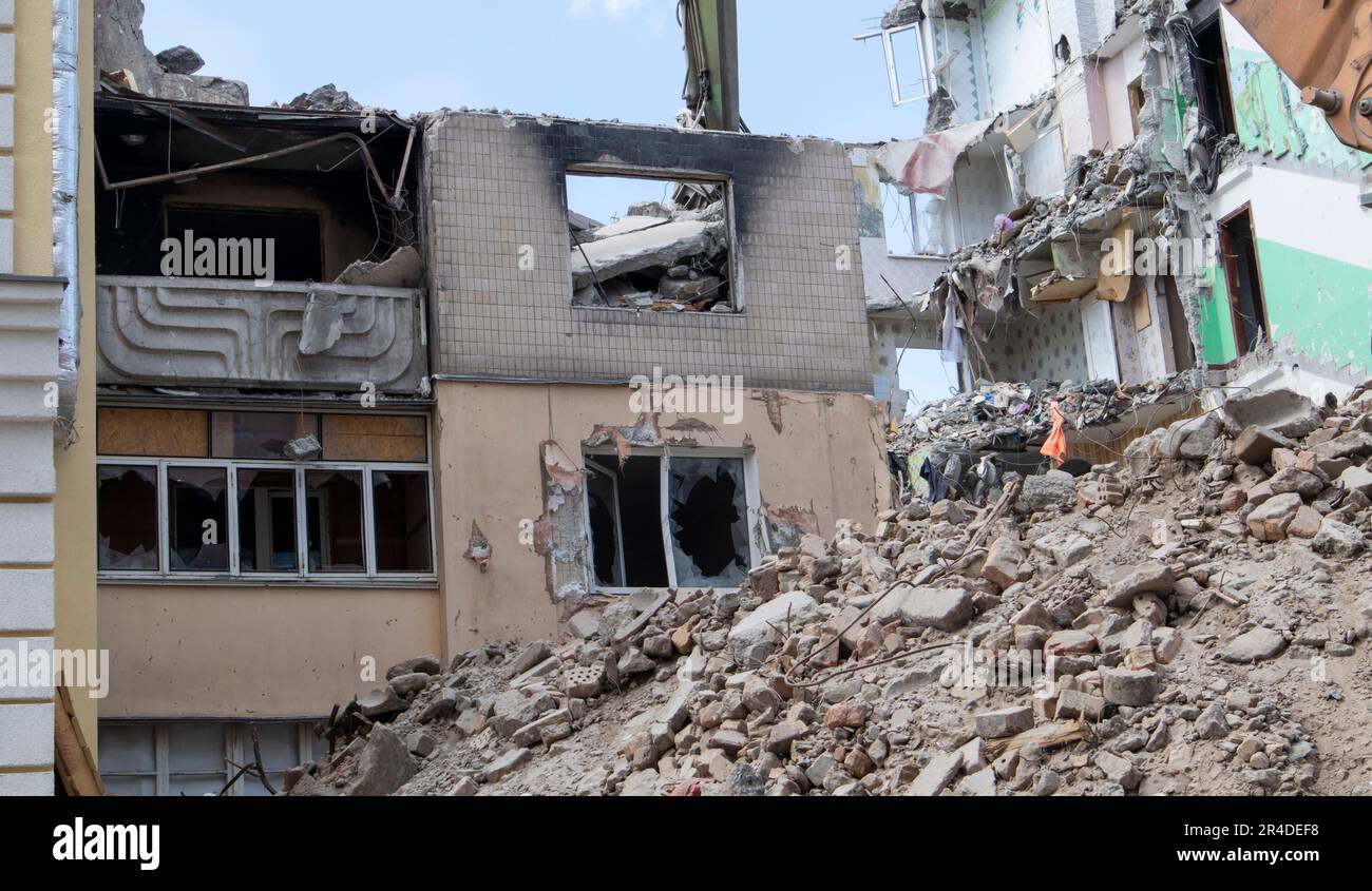 Excavator with hydraulic crusher at the demolition of a residential ...
