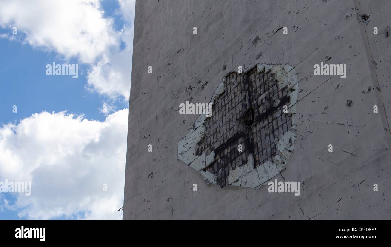 Traces of an artillery shell hitting a multi-storey residential ...