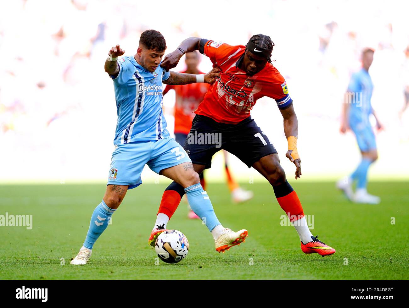 Coventry City's Gustavo Hamer (left) and Luton Town's Pelly Ruddock ...