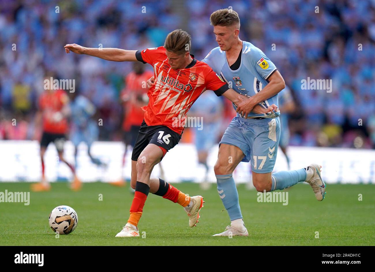 Luton Town's Reece Burke battles for the ball with Coventry City's ...