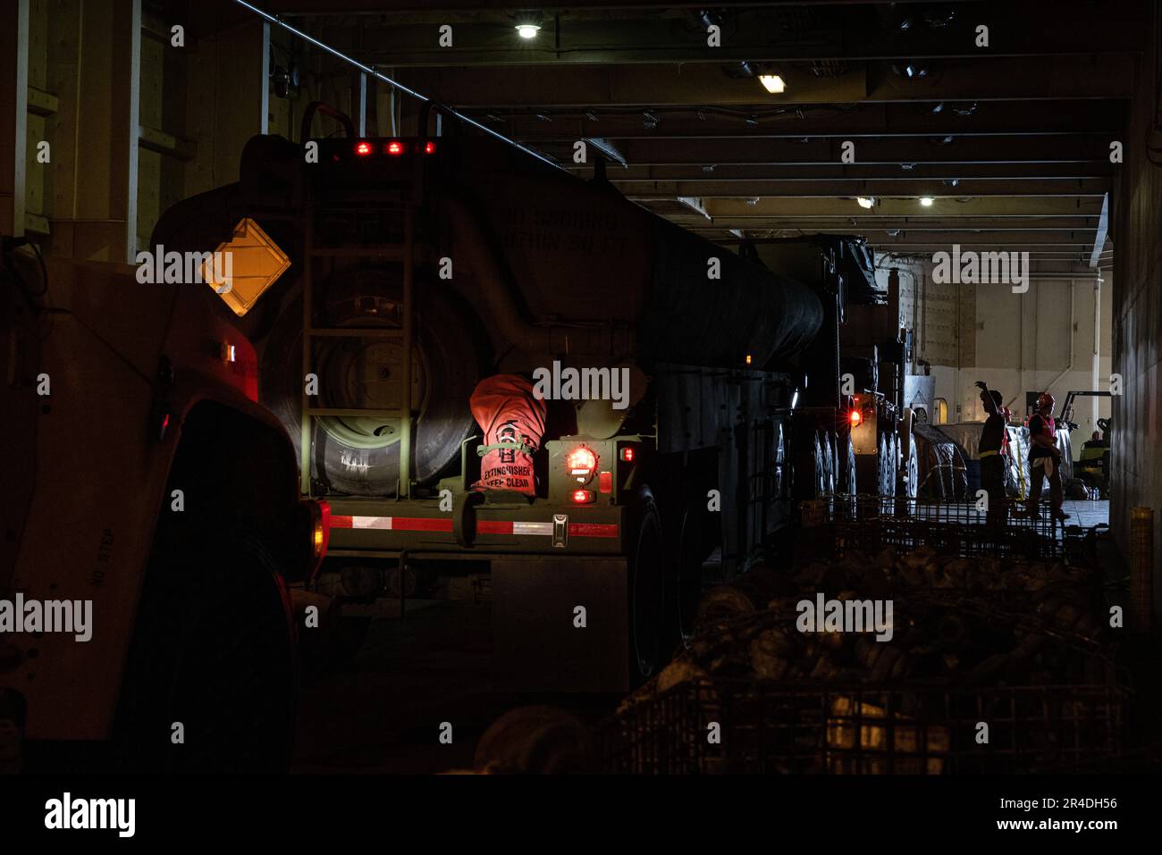 U.S. Marines with 3rd Landing Support Battalion, prepare to offload an ...