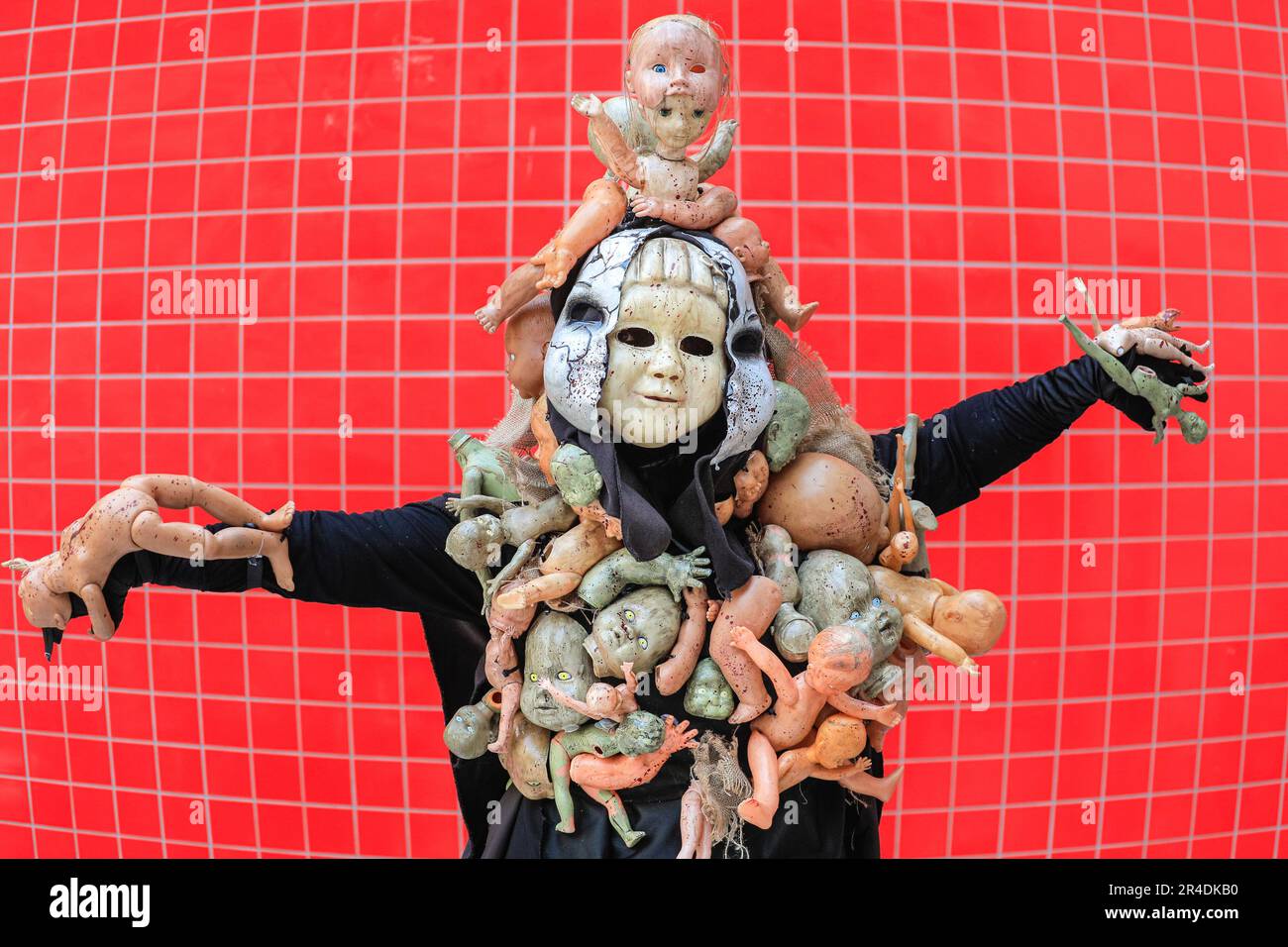 London, UK. 27th May, 2023. Alice, stiltwalking through the venue, in ...