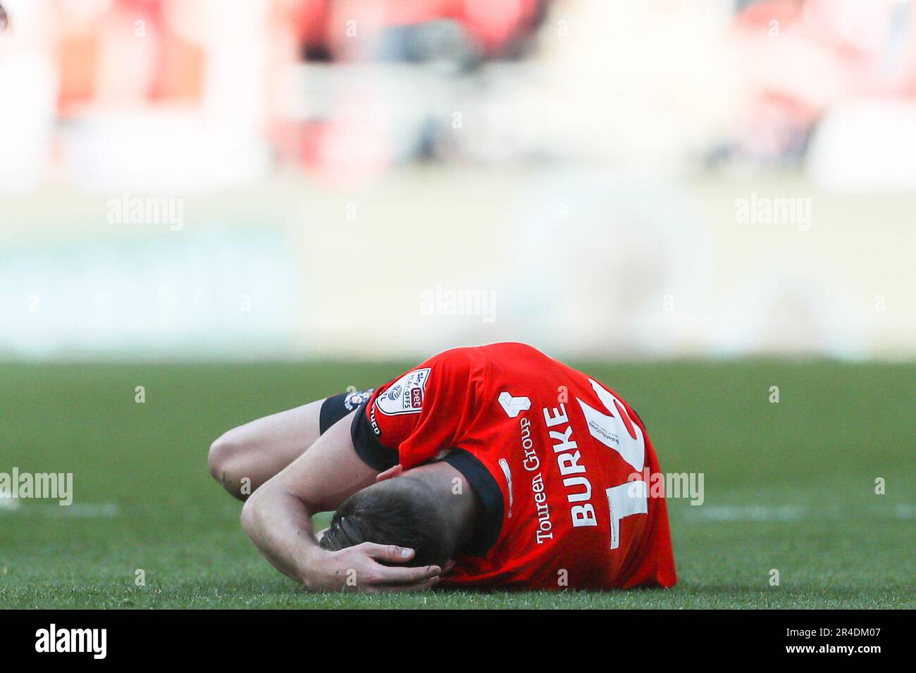 Reece Burke #16 of Luton Town goes down injured during the Sky Bet ...