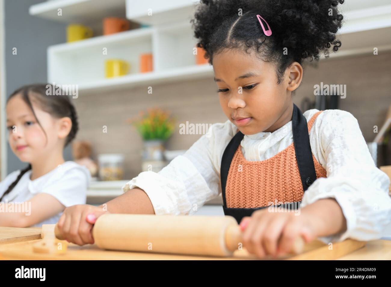 Kids playing flour in kitchen hi-res stock photography and images - Alamy