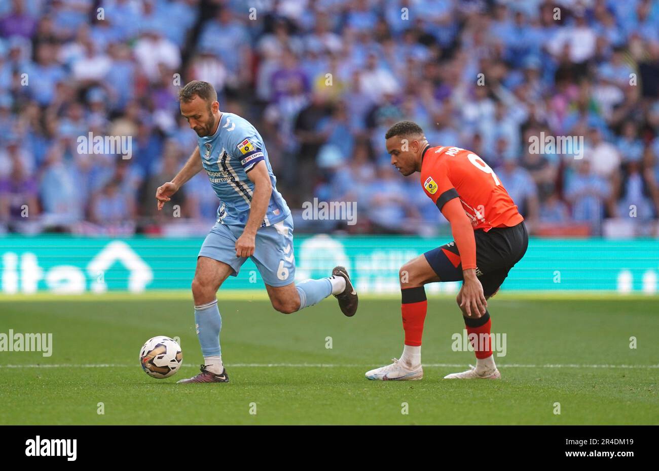 Coventry City's Liam Kelly gets past Luton Town's Carlton Morris during ...