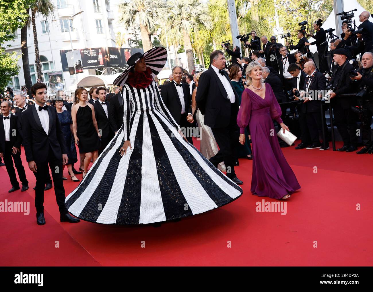 Ikram Abdi poses for photographers upon arrival at the awards ceremony ...