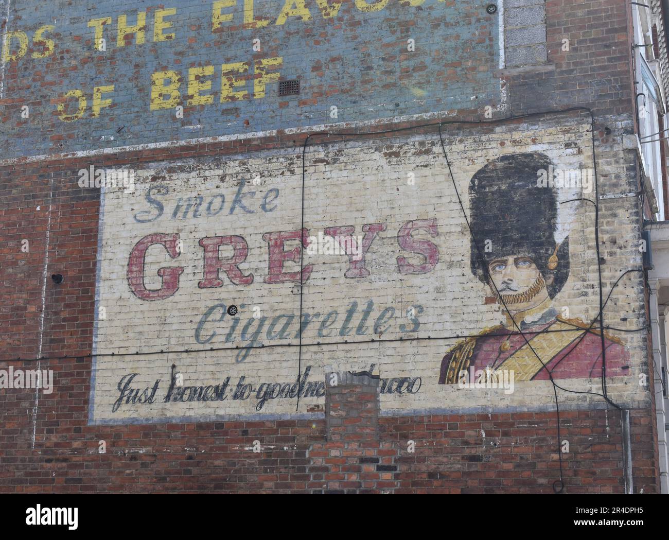 A ghost ad for Grey's cigarettes on a house in Bedford Stock Photo - Alamy