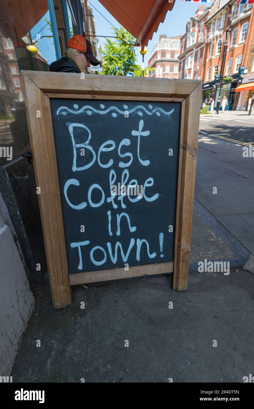 Chalk board advertising "best coffee in town" outside coffee shop on ...