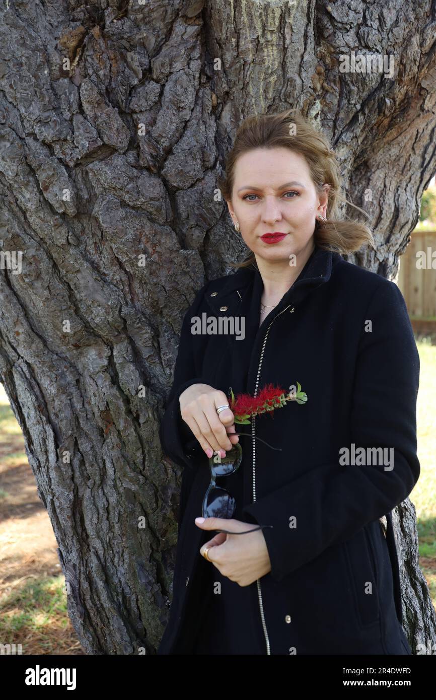 Photo of beautiful Russian lady in a park by a lake Stock Photo - Alamy