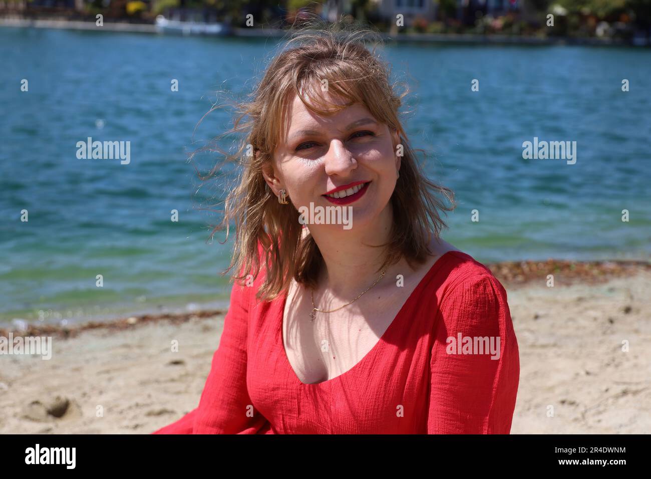 Photo of beautiful Russian lady in a park by a lake Stock Photo - Alamy