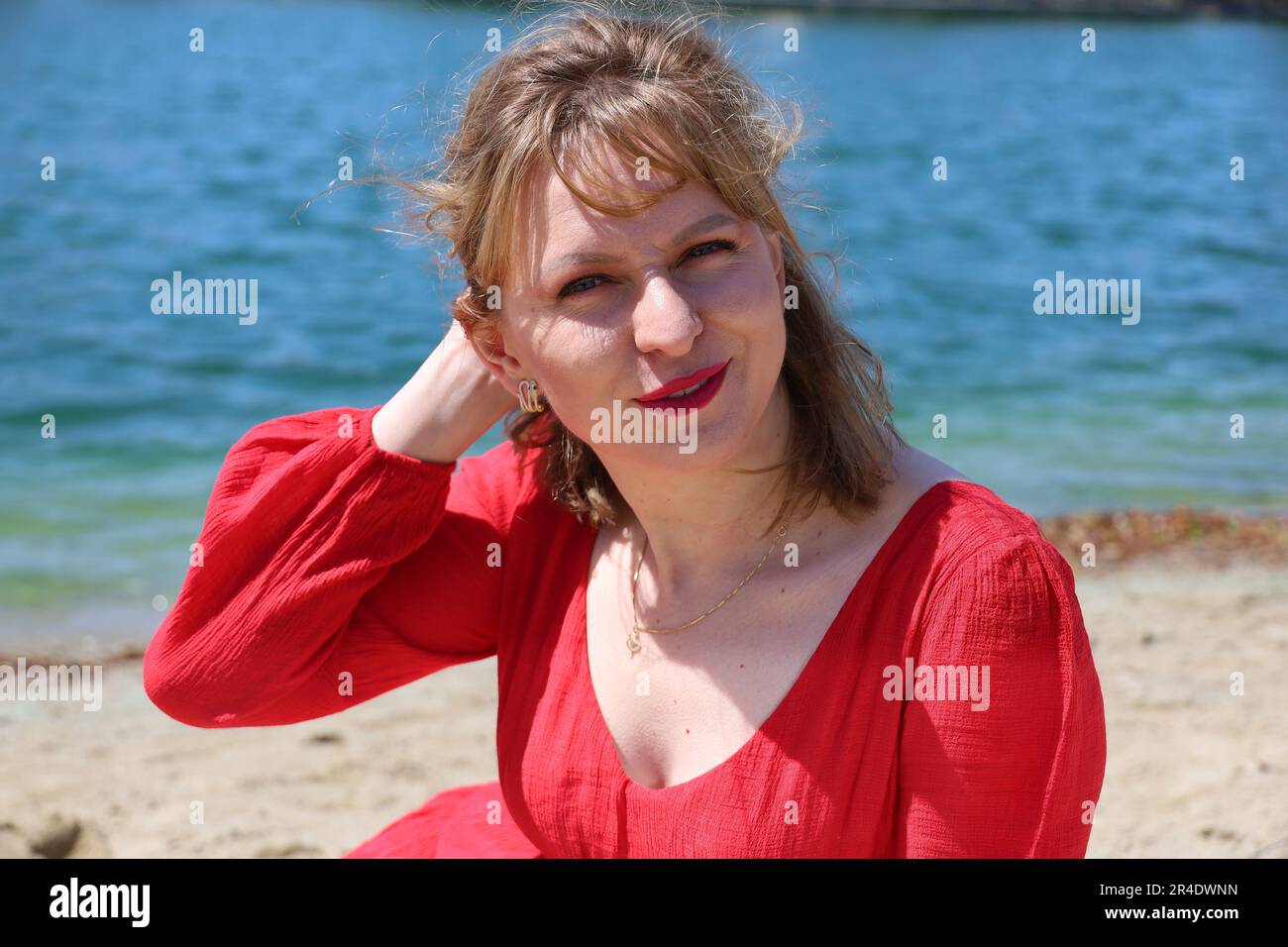 Photo of beautiful Russian lady in a park by a lake Stock Photo - Alamy