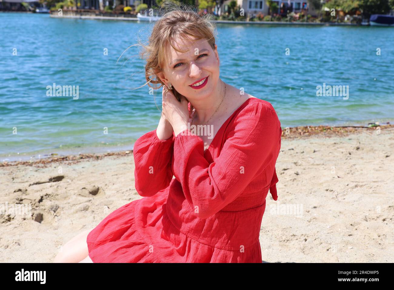 Photo of beautiful Russian lady in a park by a lake Stock Photo - Alamy