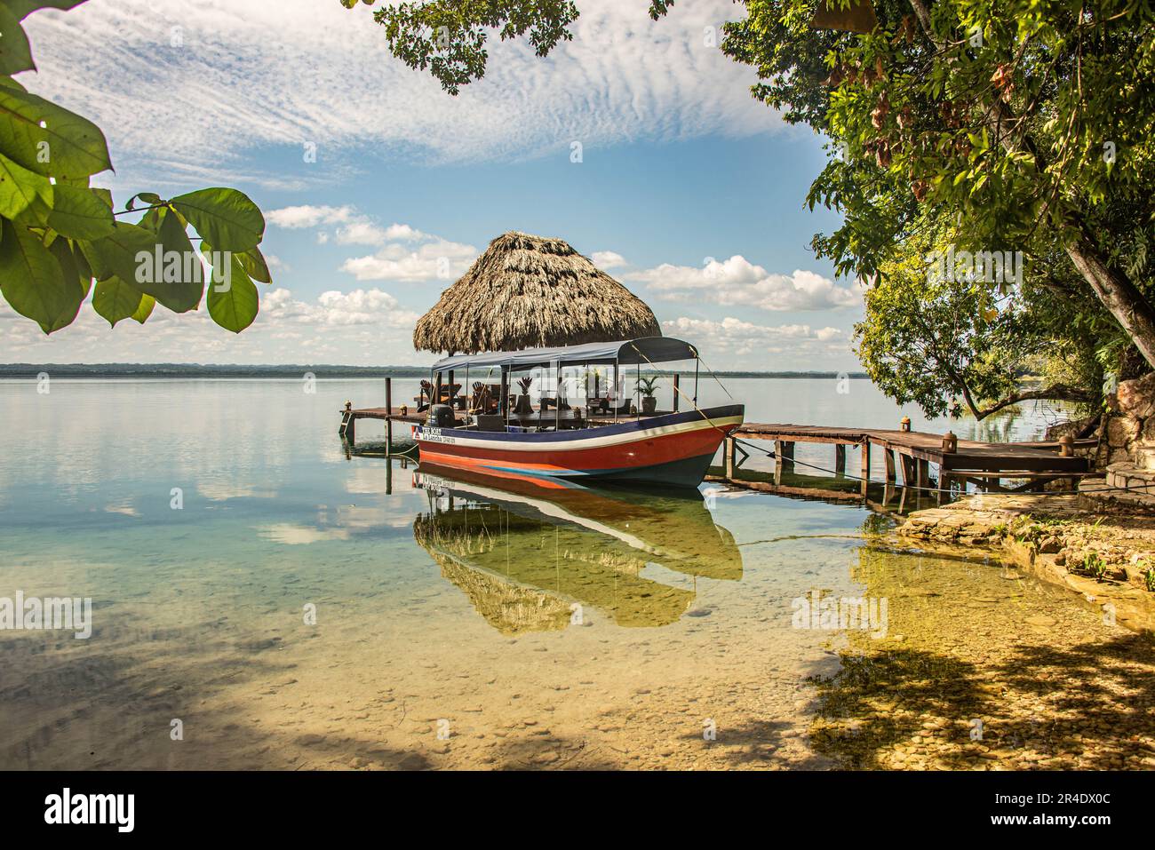 Dock and palapa hut on beautiful Lake Peten Itza, El Remate, Petén ...