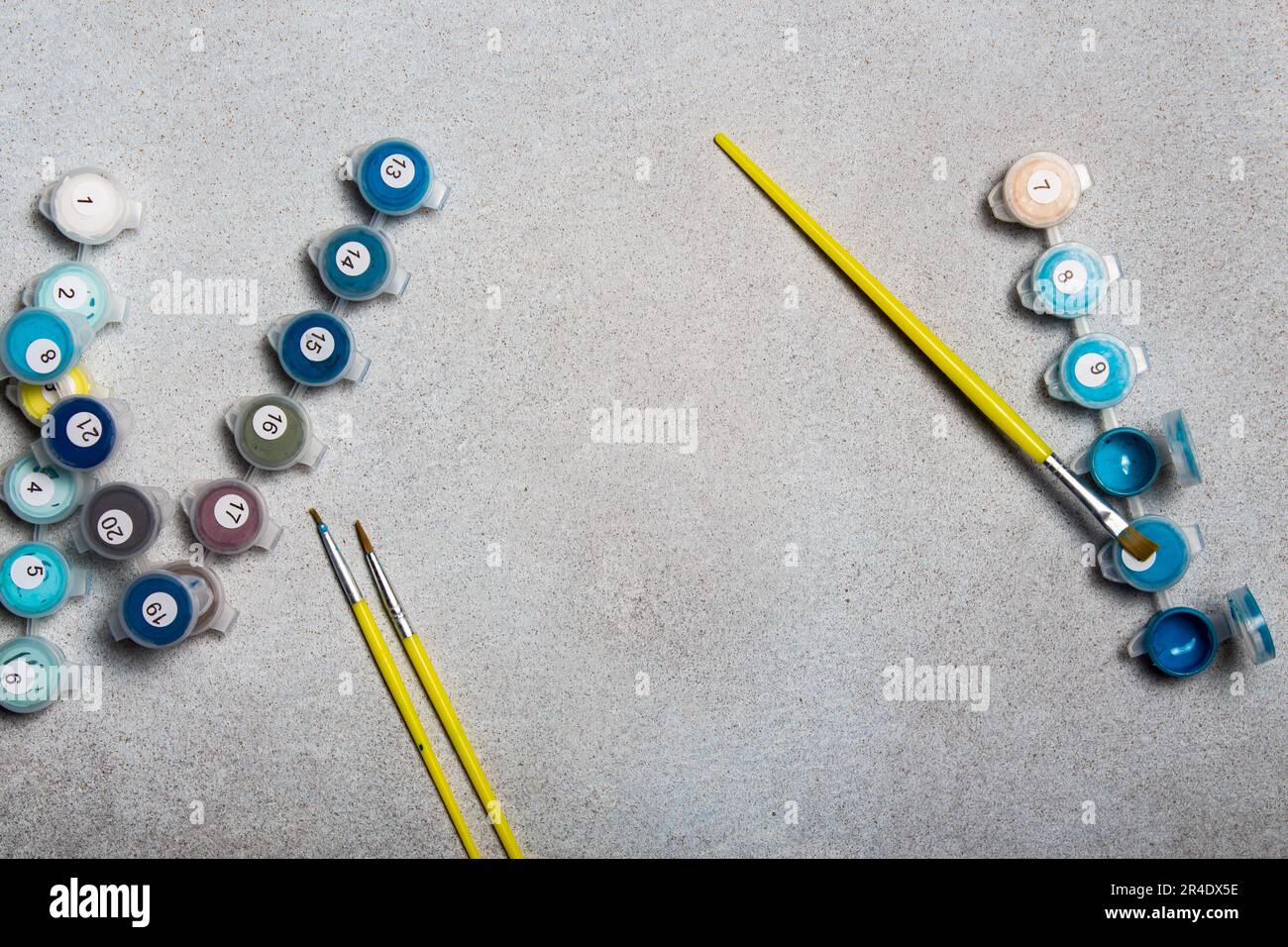 Paints, brushes for painting by numbers activity. Hobby and leisure ...