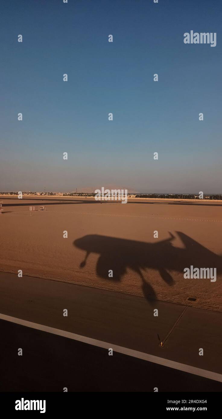 The shadow of an aircraft about to touch down at Sharm el Sheikh, Egypt ...