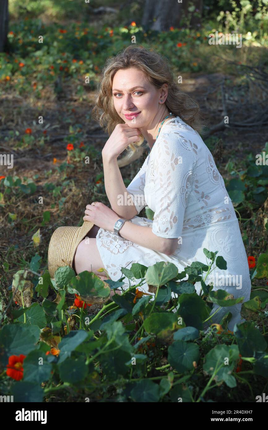 Photo of a Beautiful Russian Lady in a tulip garden by a windmill Stock ...